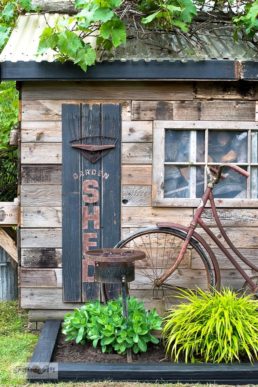 Rustic DIY garden shed sign with a rusty rakeFunky Junk Interiors